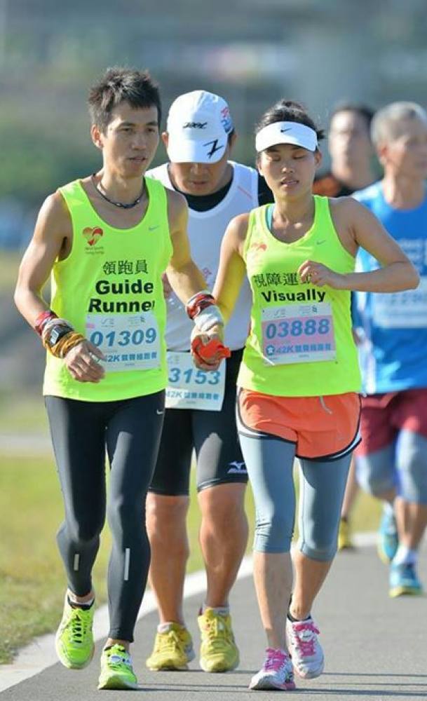 Hong Kong runners prove love is blind as visually impaired woman and ...