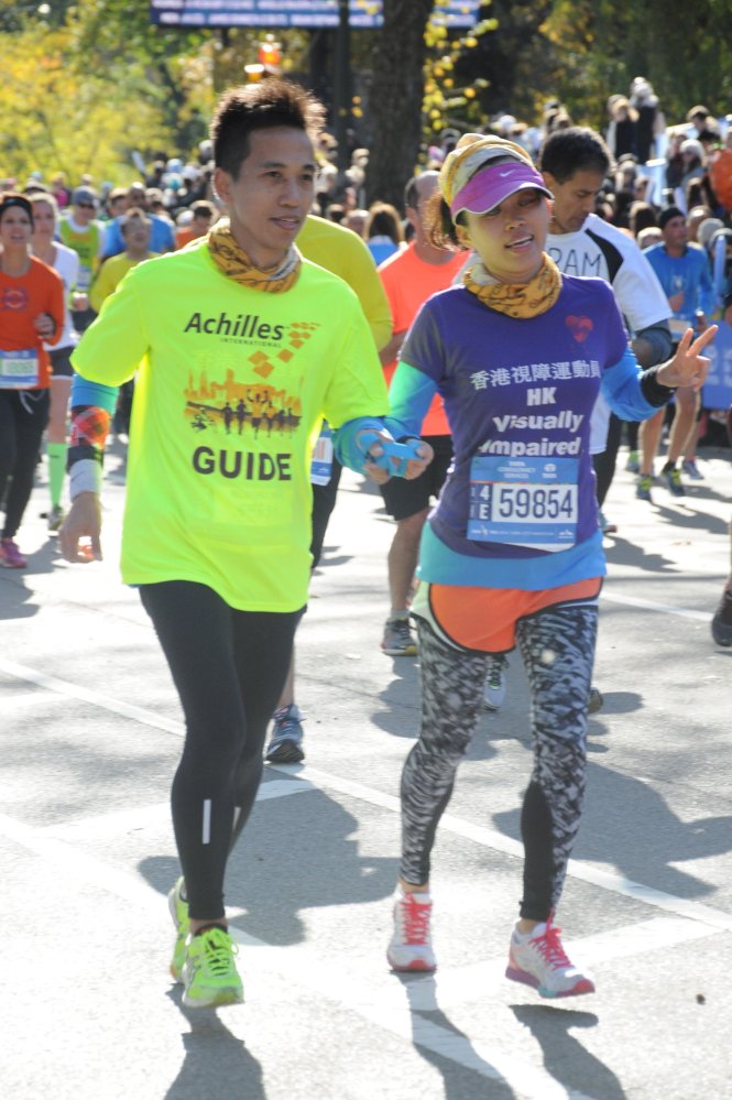 Hong Kong runners prove love is blind as visually impaired woman and ...