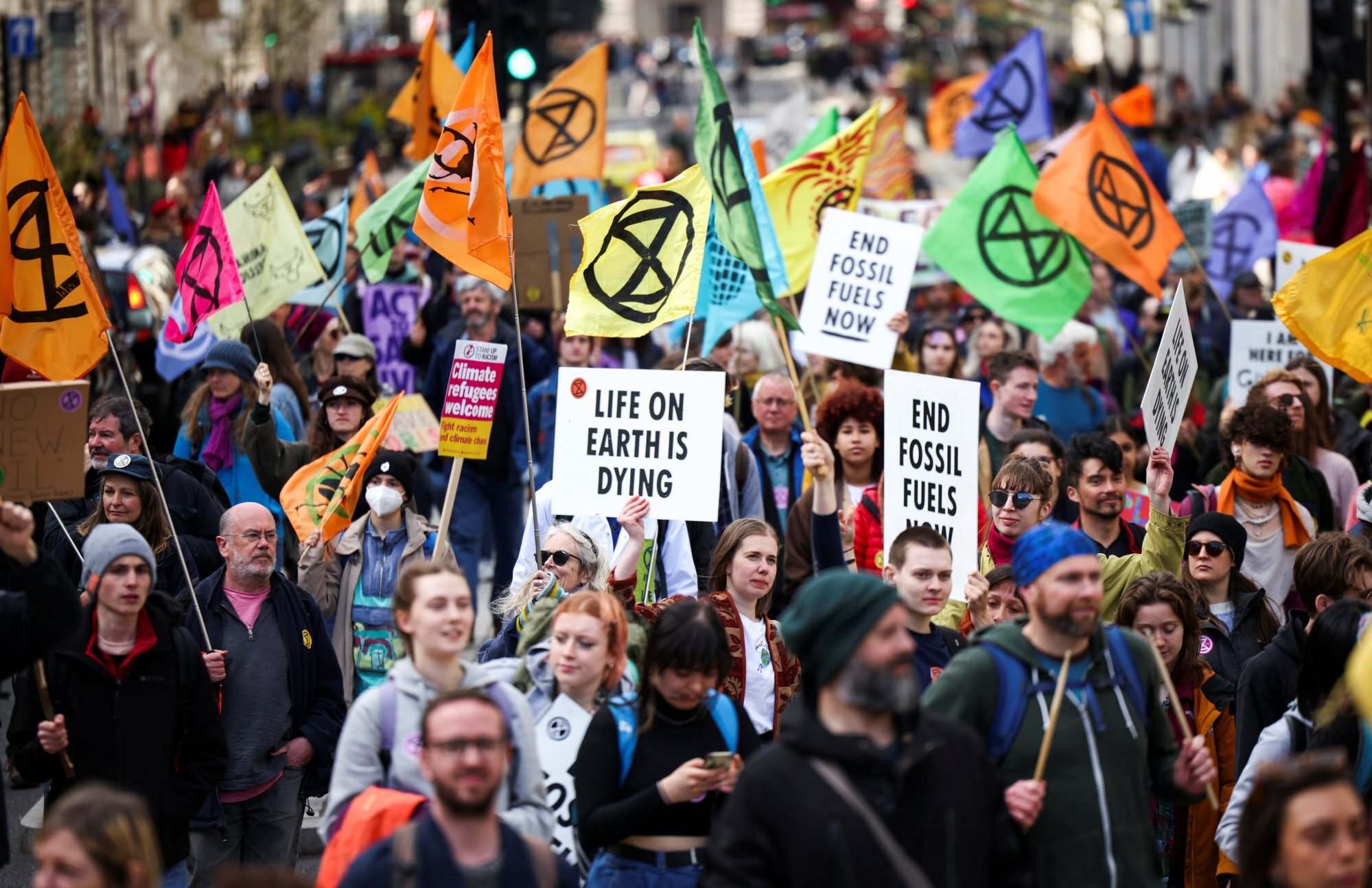 Extinction Rebellion climate activists stage sit-down protests in ...