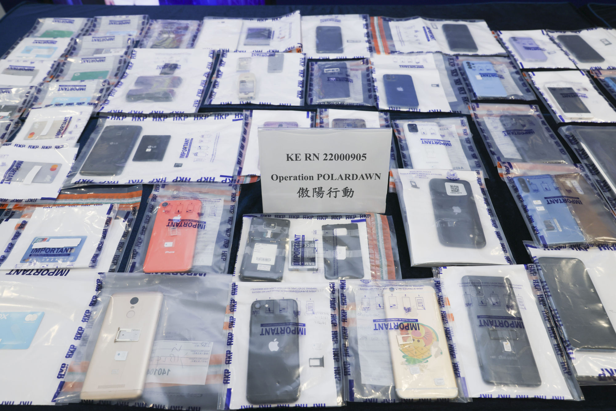 Police arrest 56 from suspected fraud syndicate that scammed HK$7 ...