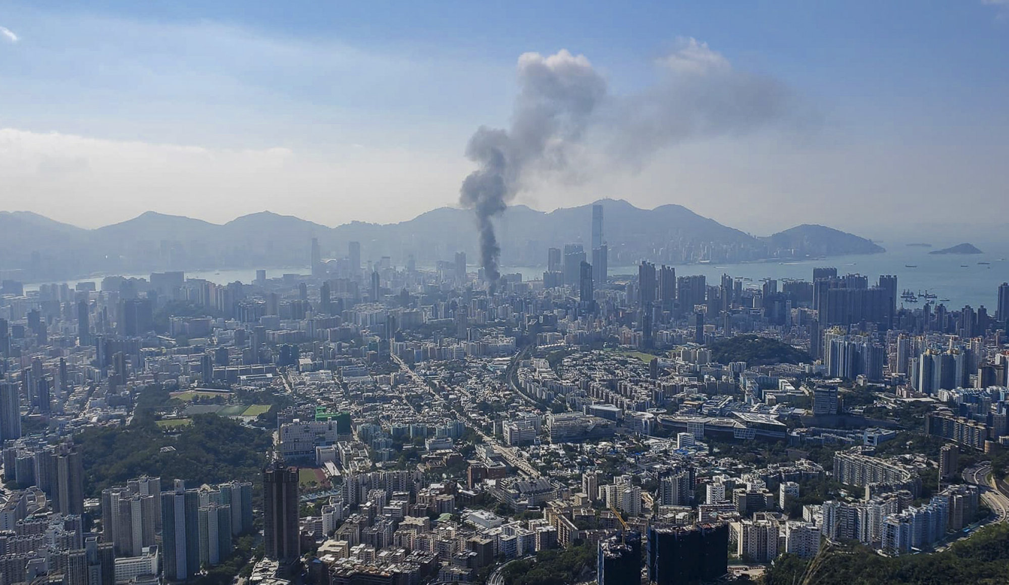 92 people evacuated after fire breaks out at podium of Hong Kong ...