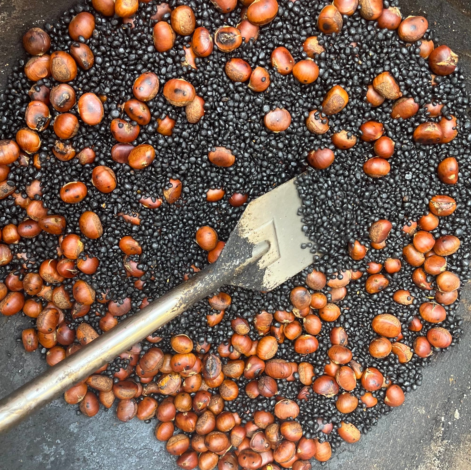 Chestnuts roasting in an open wok: Hong Kong hawker on a winter street ...