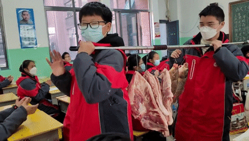 School in China rewards top students with 10,000kg of raw pork cuts and ...