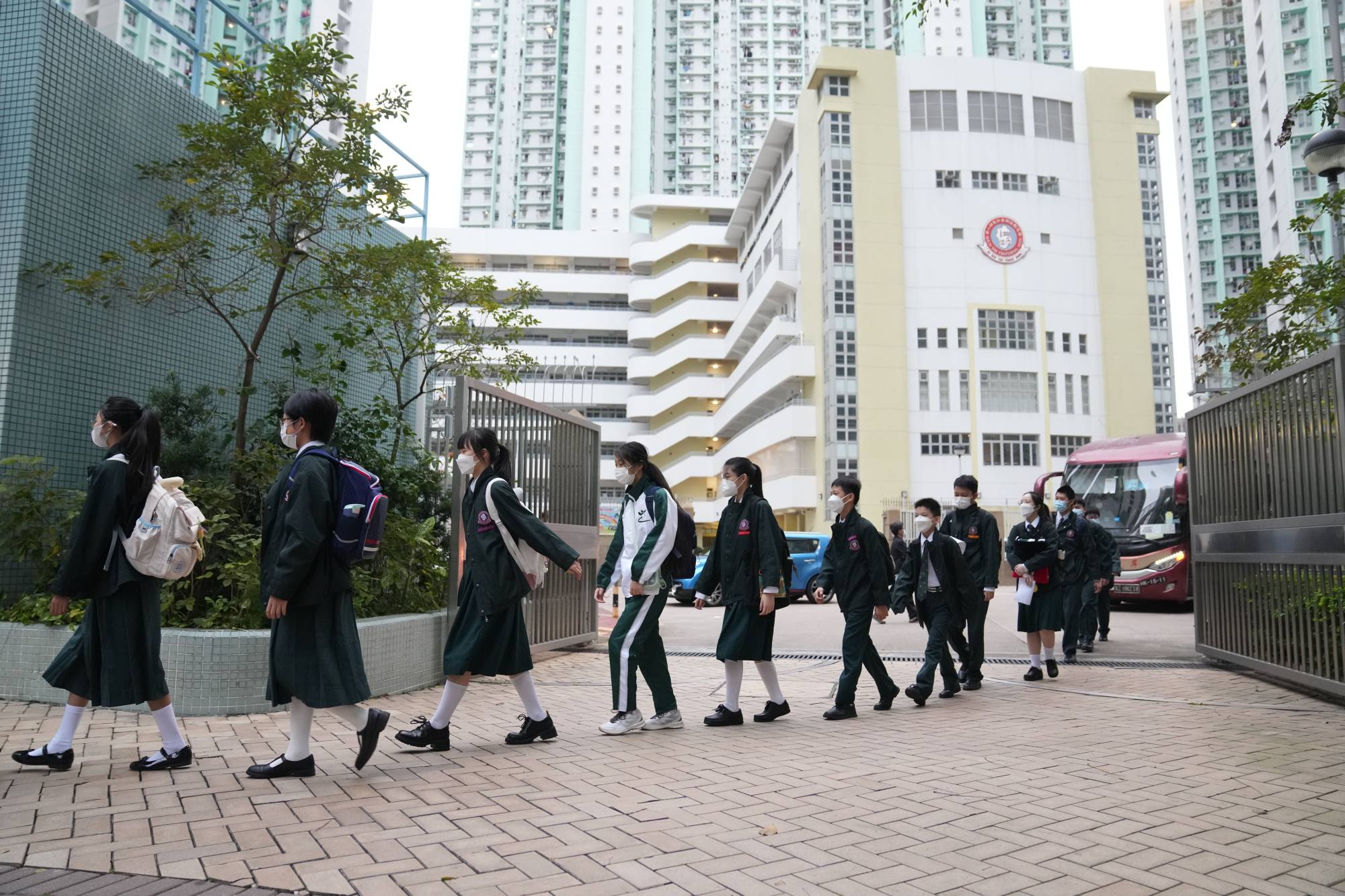 Hong Kong welcomes back cross-border students as parents, children hail ...