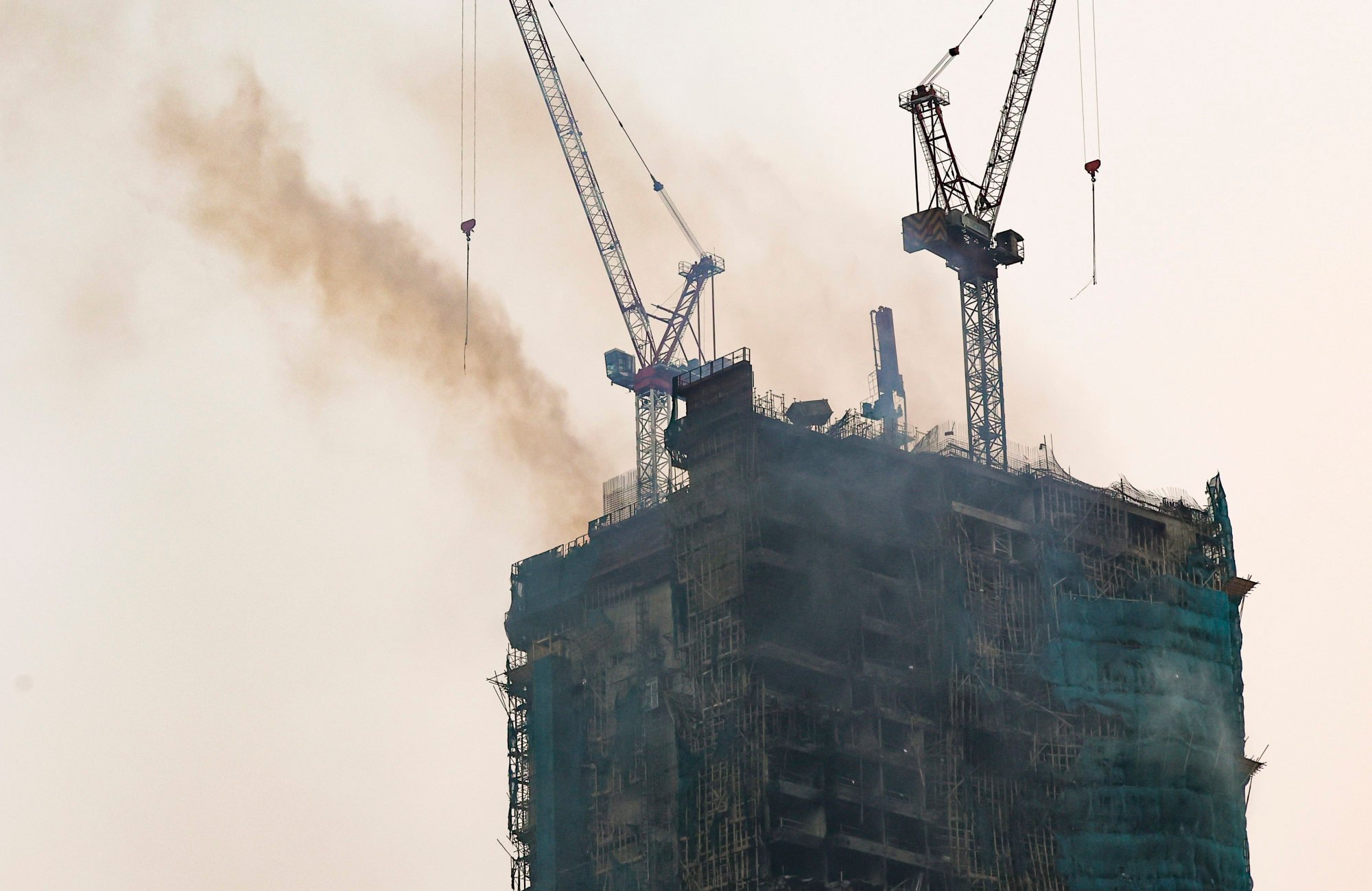 Safety checks at skyscraper after Hong Kong firefighters battle blaze ...