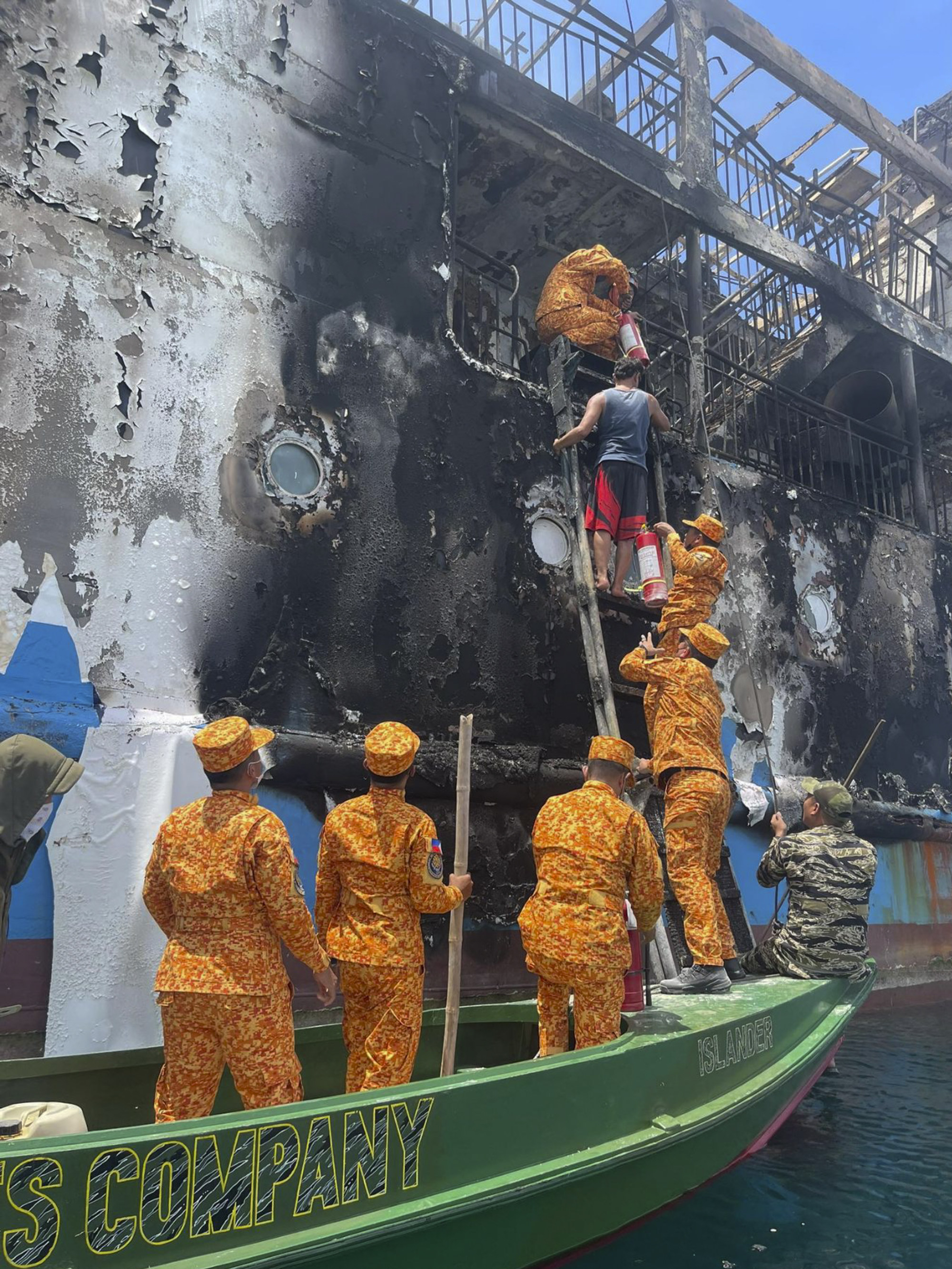 Tragic scenes of death in burned Philippine ferry move rescuers to ...