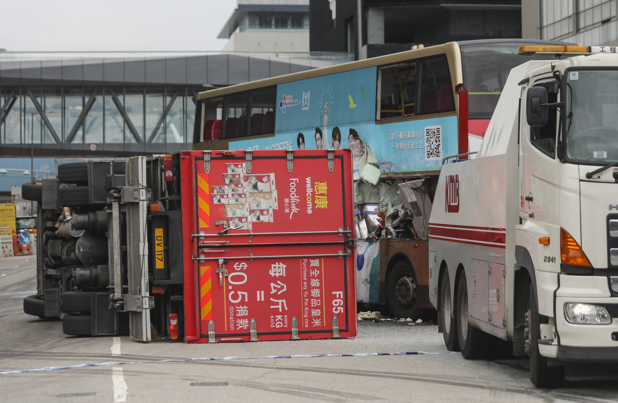 7 injured after truck collides with KMB bus and topples over in Hong ...