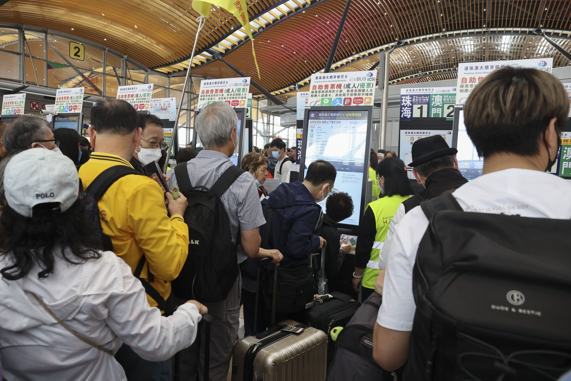 Thousands in Hong Kong queue up for cross-border shuttle to visit Macau ...