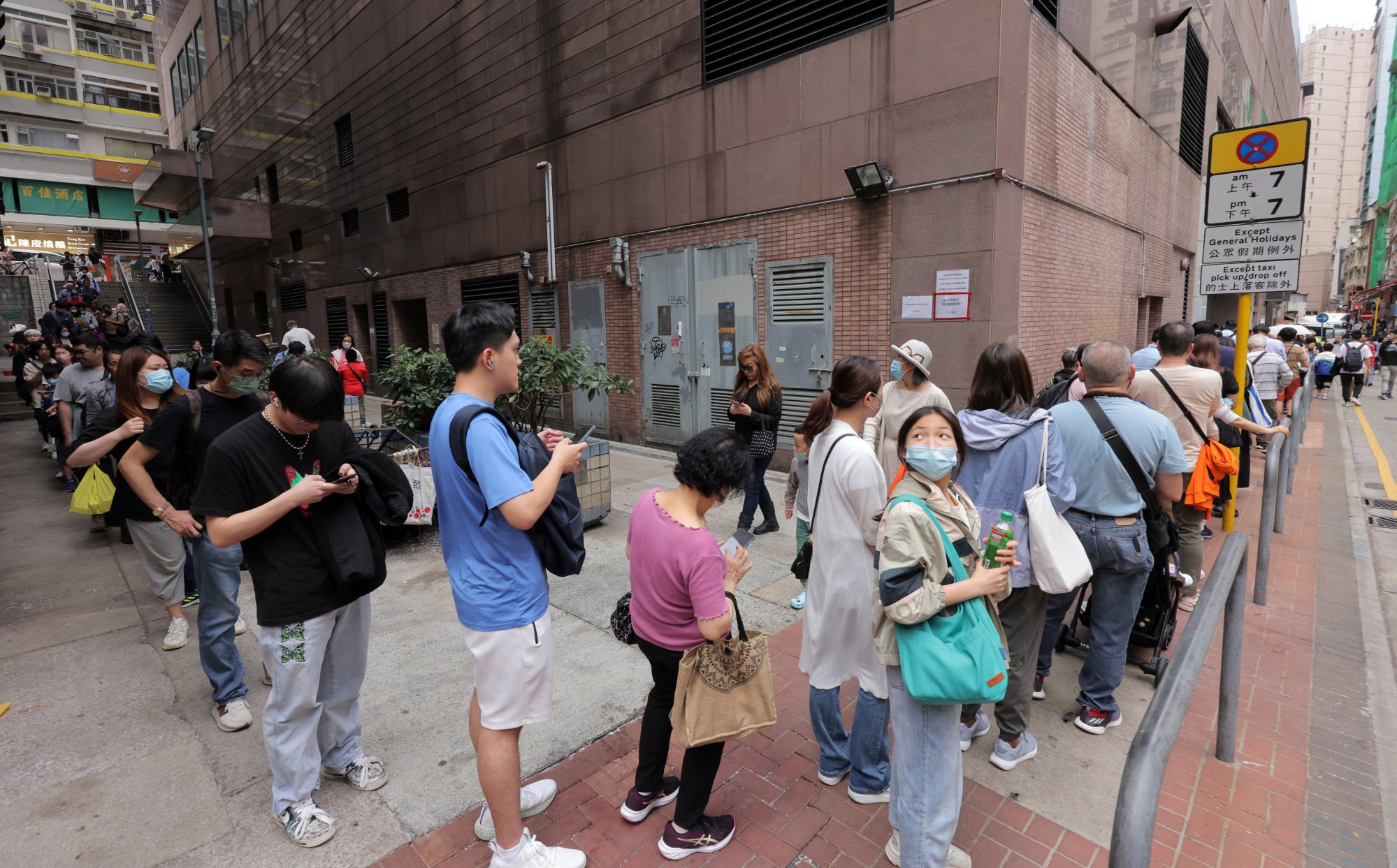 ‘Just queue and wait’: Hong Kong grapples with massive number of ...
