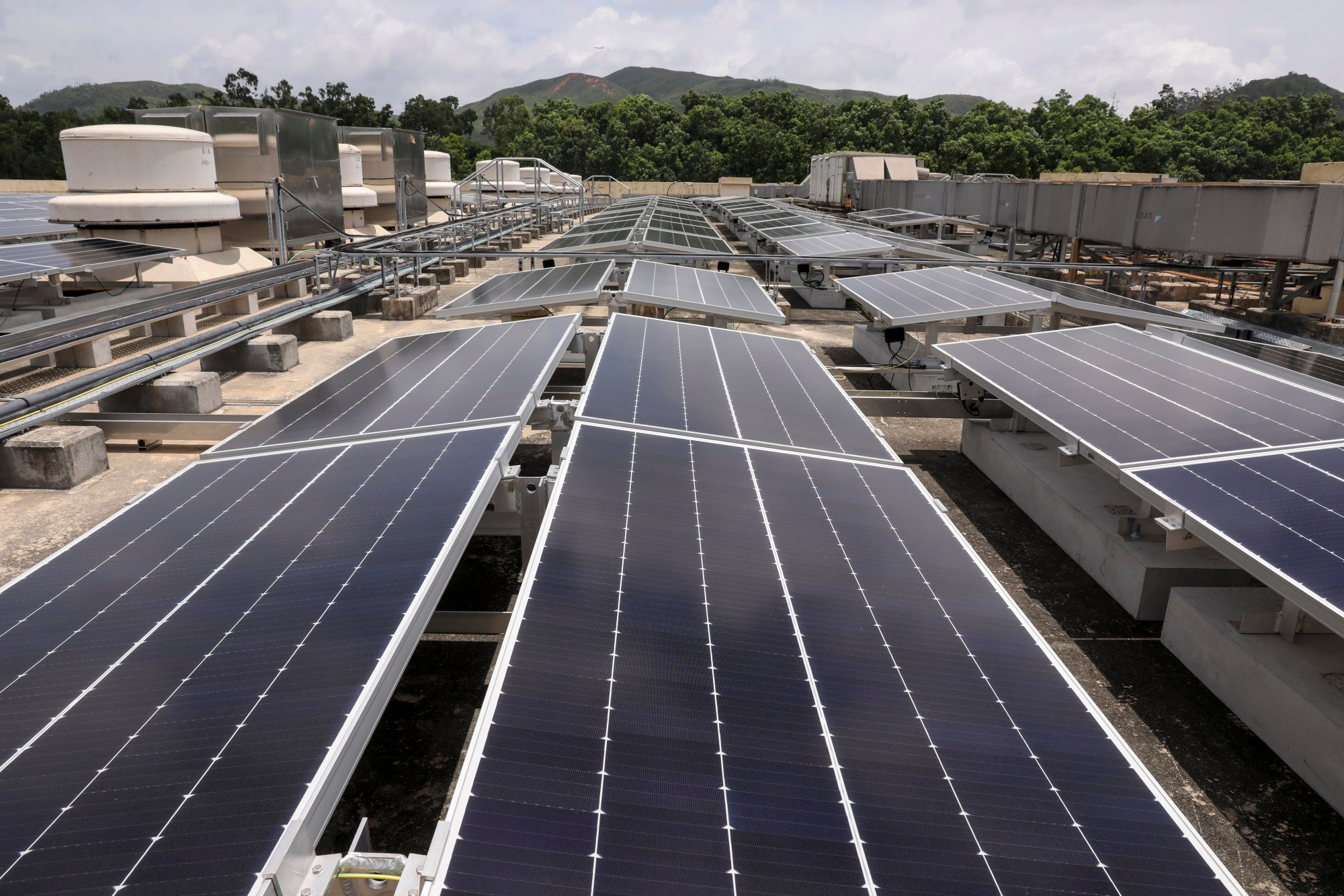 Solar panel array that flew off Hong Kong building was illegal and ...