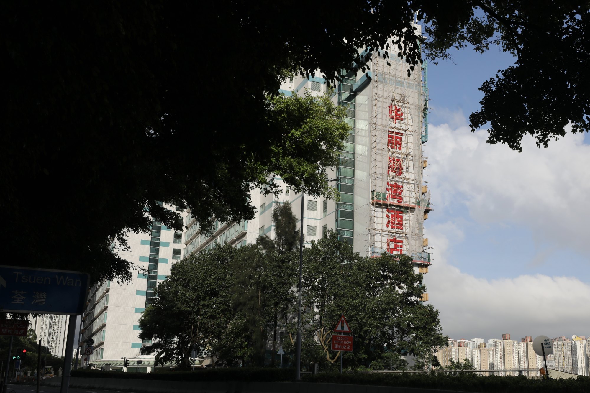 Giant neon sign on Hong Kong hotel sparks heated online debate ...