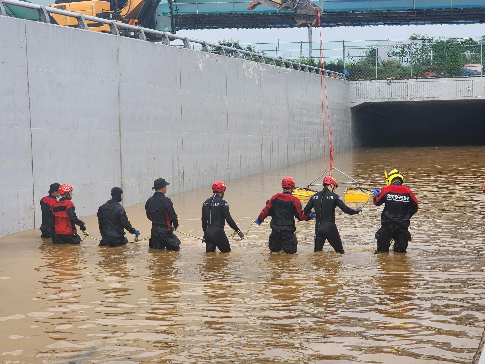 In South Korea, bodies recovered from flooded tunnel, as more than 30 ...