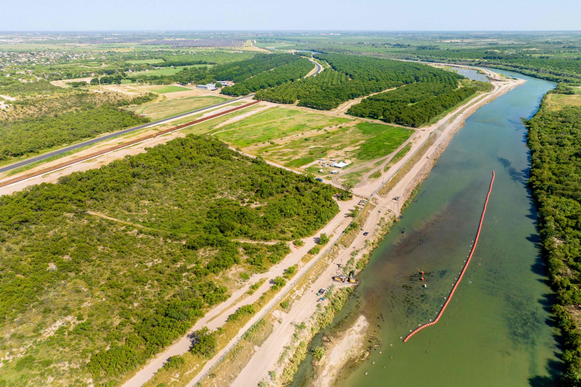 US sues Texas over floating border barriers meant to stop migrants ...