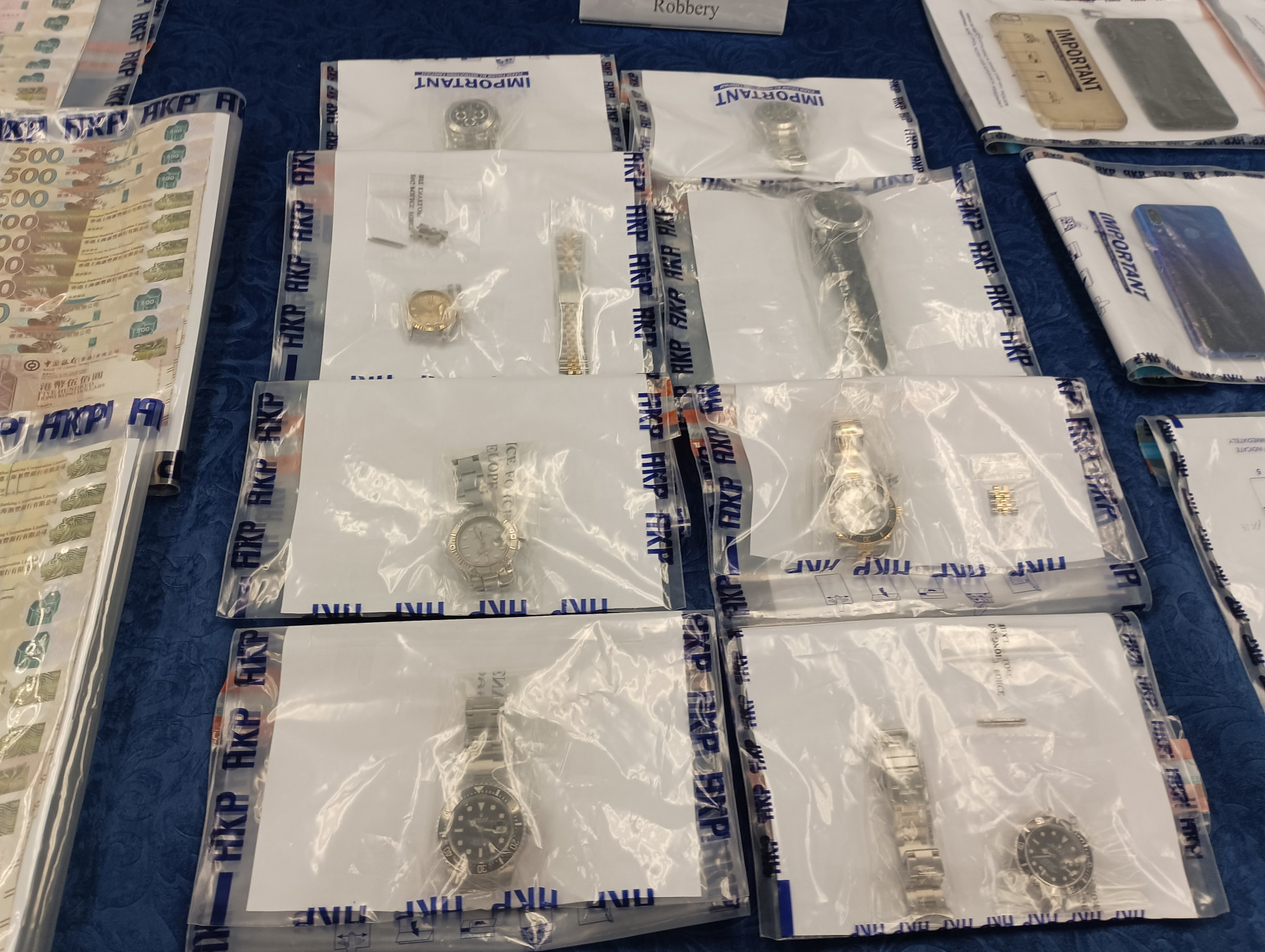 Hong Kong police arrest 9 alleged gang members over HK$7 million watch ...