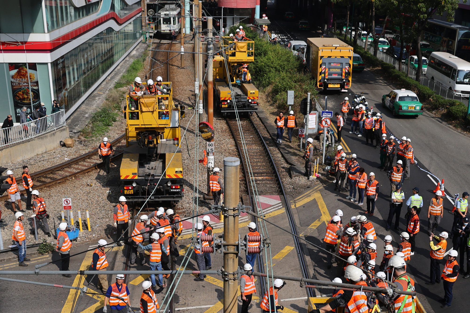 Driver arrested after crane truck hits overhead cable, disrupting ...