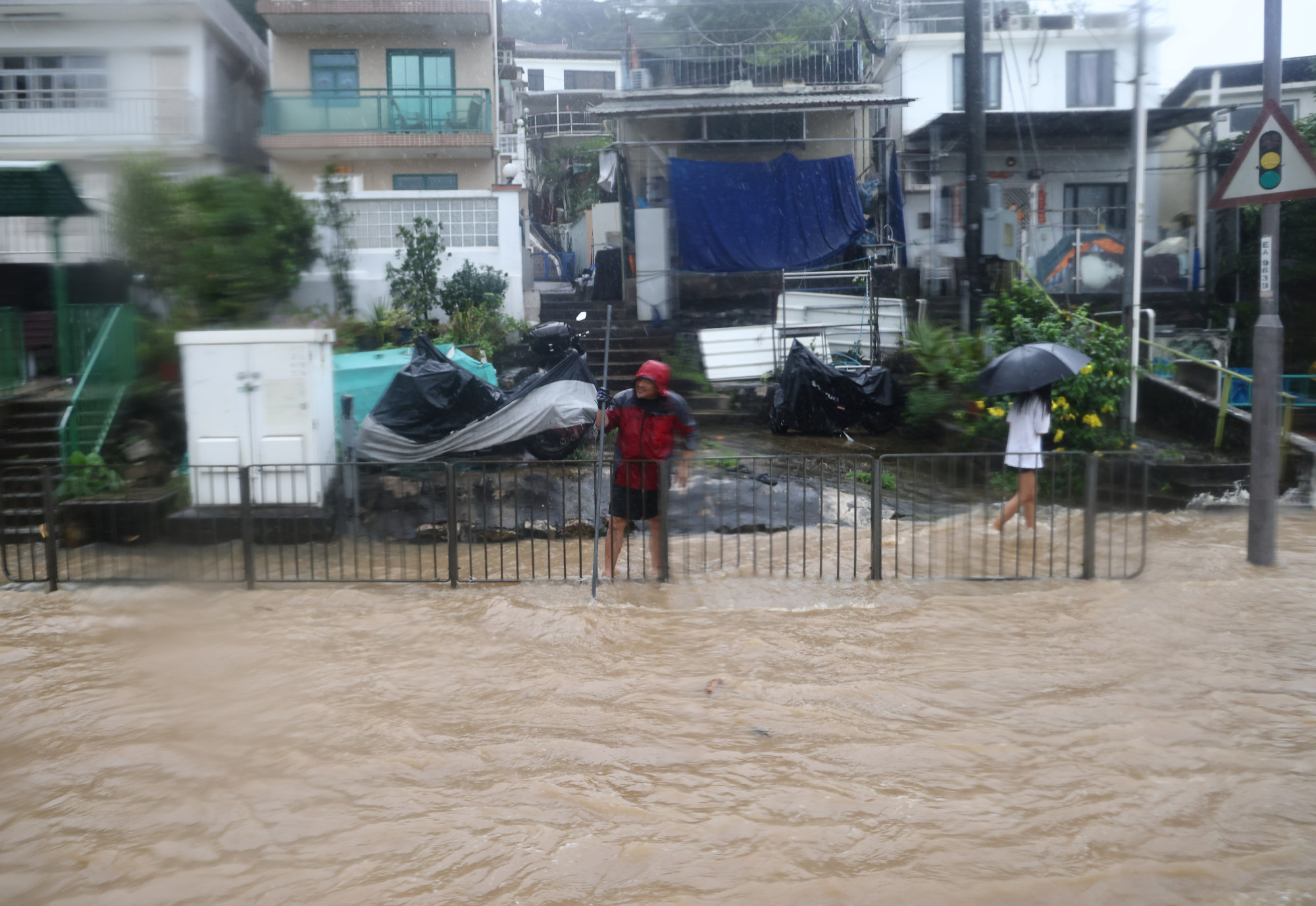‘Dangerous’: Hong Kong rainstorm warning ignored as football Premier ...