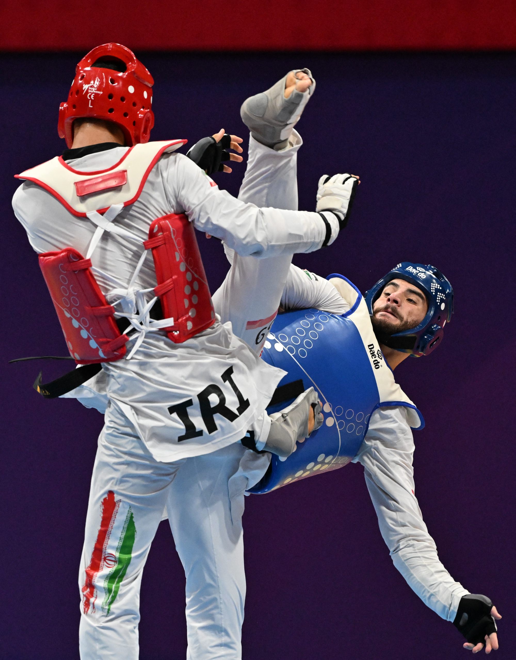 Chinese sanda vs Korean taekwondo: Asian martial arts both built on ...