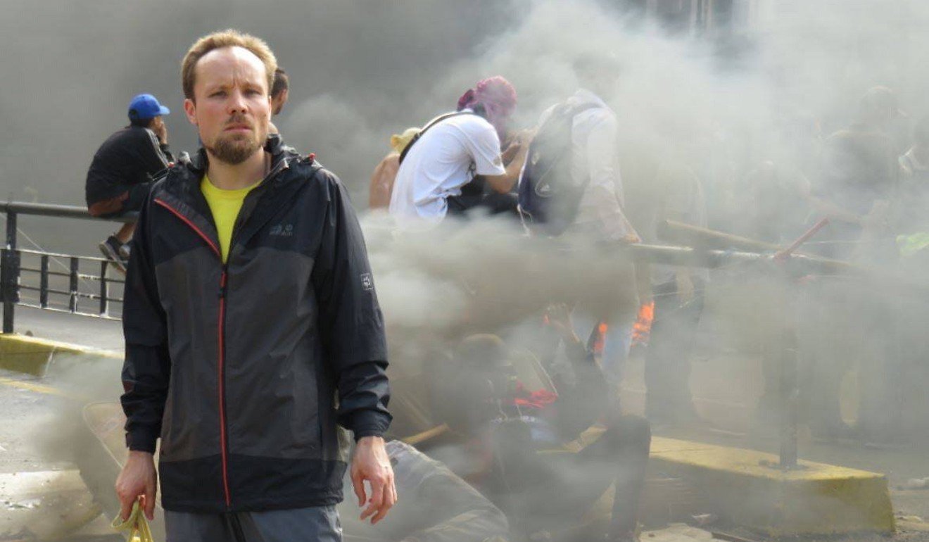 German journalist Billy Six freed after four-months in Venezuela jail ...