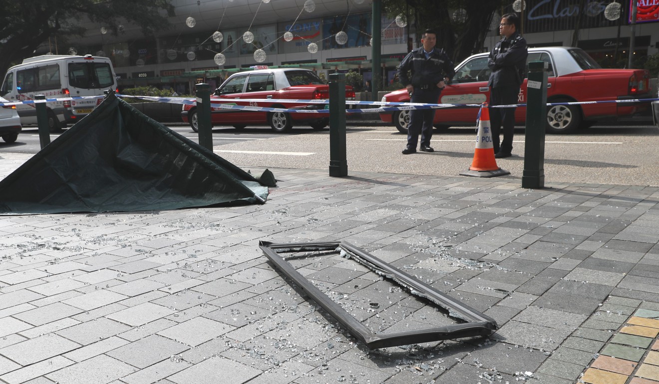 Two hurt and woman arrested after window falls from seventh floor of ...