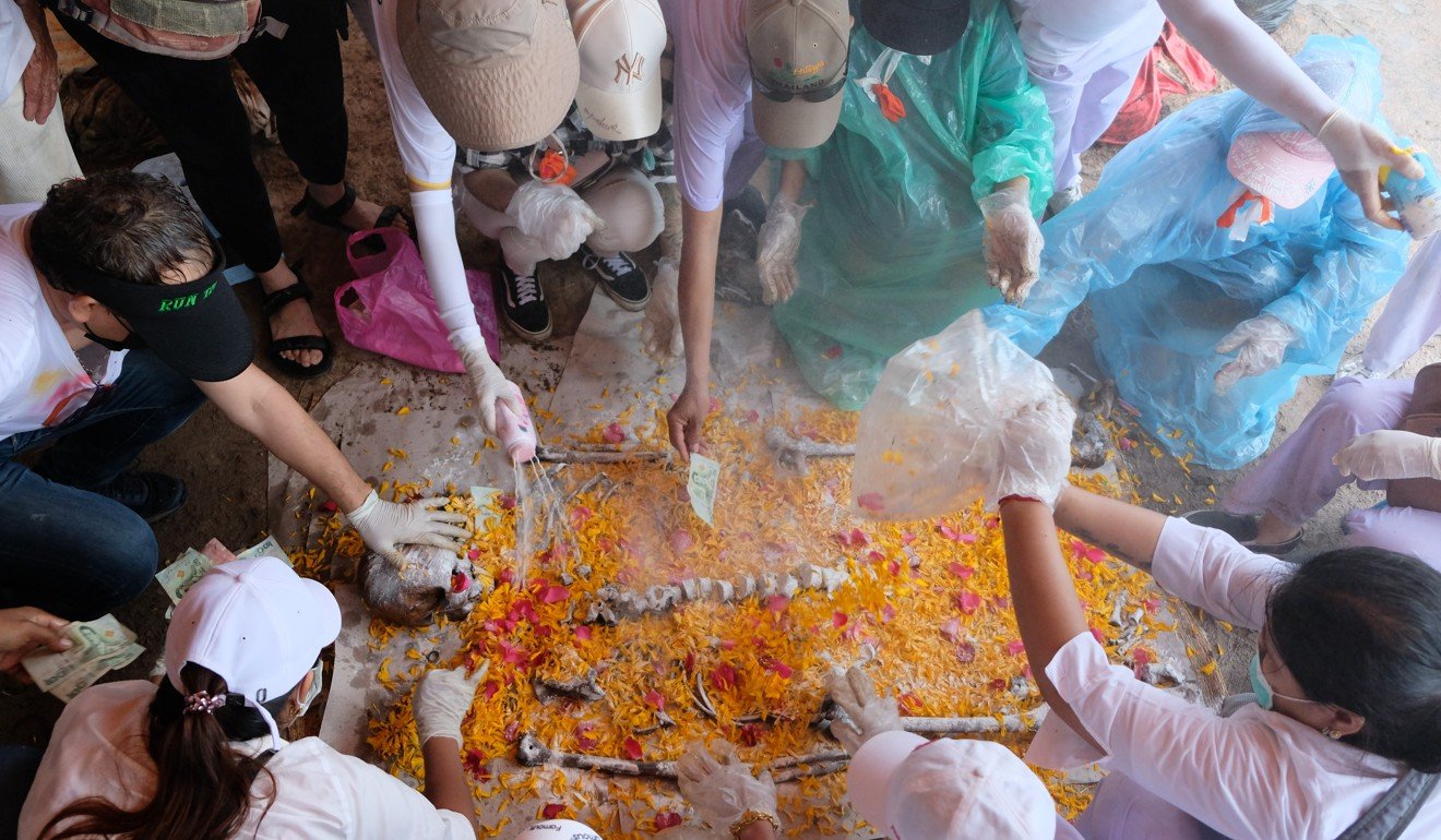 Digging up the dead: the Thai ceremony to pamper neglected human ...