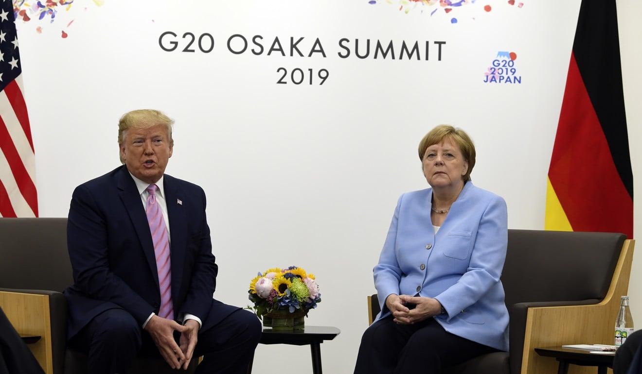 Donald Trump, Angela Merkel present friendly front at Japan G20 ...