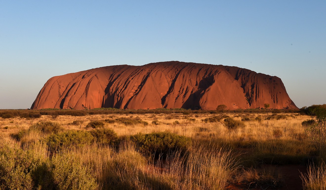 Tourists rush to climb Uluru ahead of hiking ban, bringing trash ...