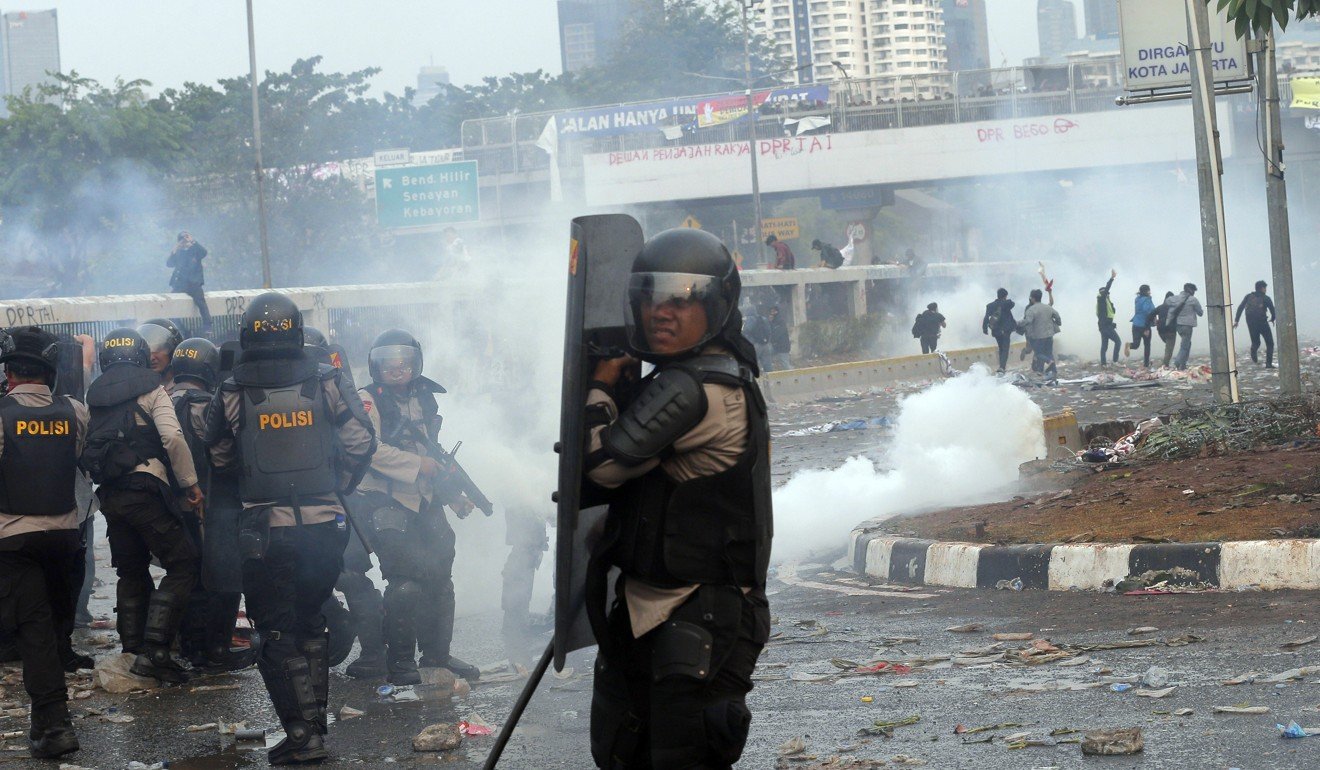 Indonesian police fire tear gas at thousands of students protesting ...