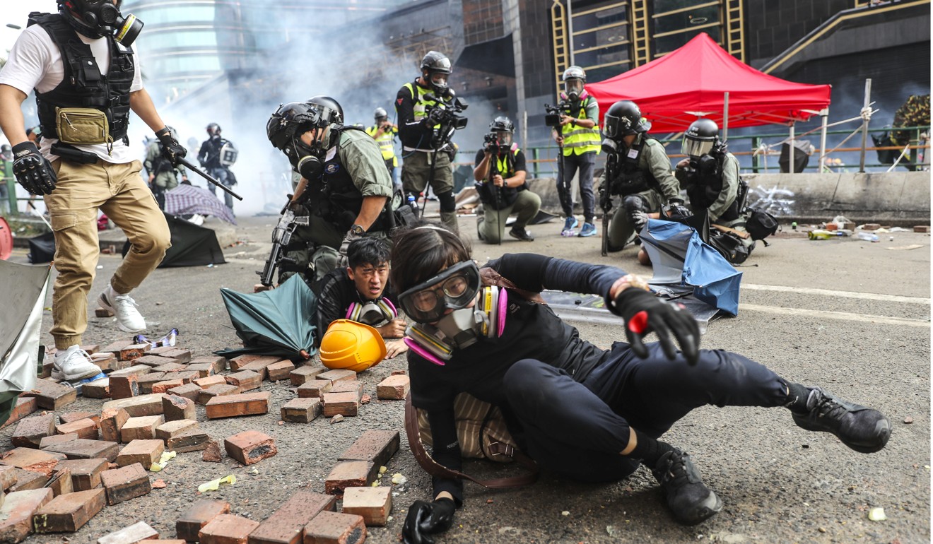 Riot police to guard all polling stations in protest-hit Hong Kong for ...