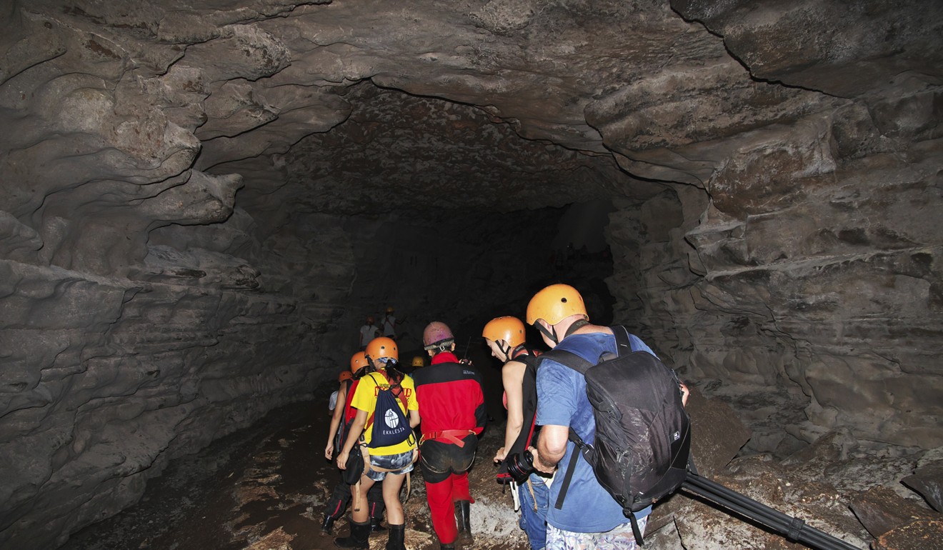 Indonesia cave adventure: 60 metres down a rope is an ancient mini ...