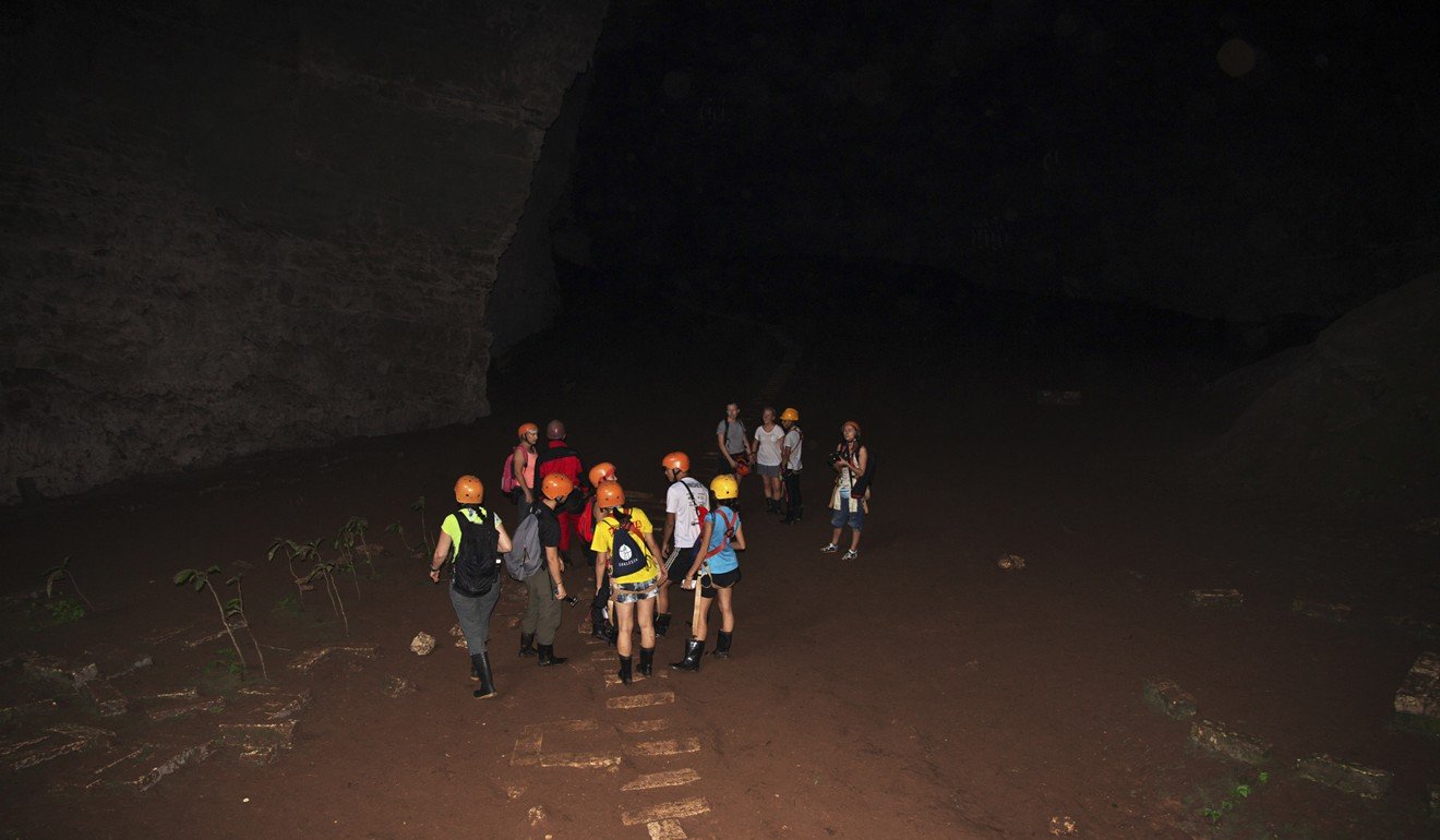 Indonesia cave adventure: 60 metres down a rope is an ancient mini ...