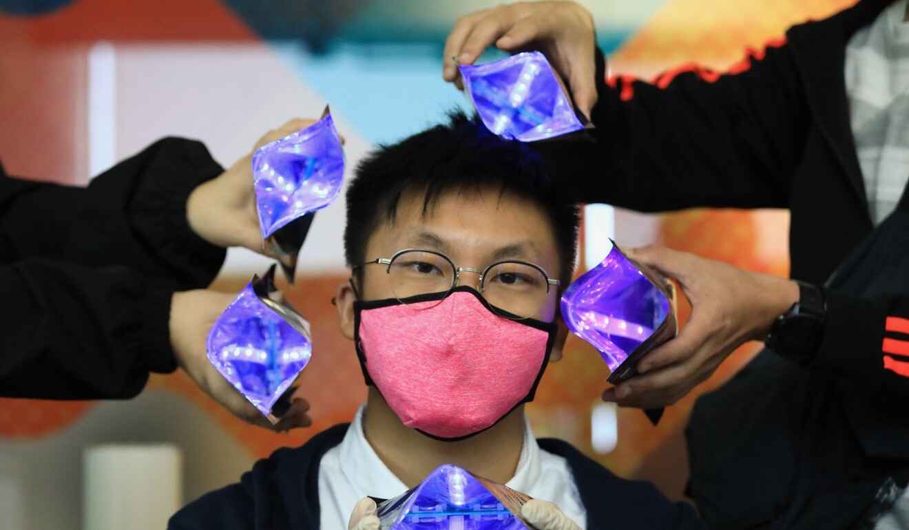 Coronavirus: Hong Kong inventor unveils reusable masks he says employ ...