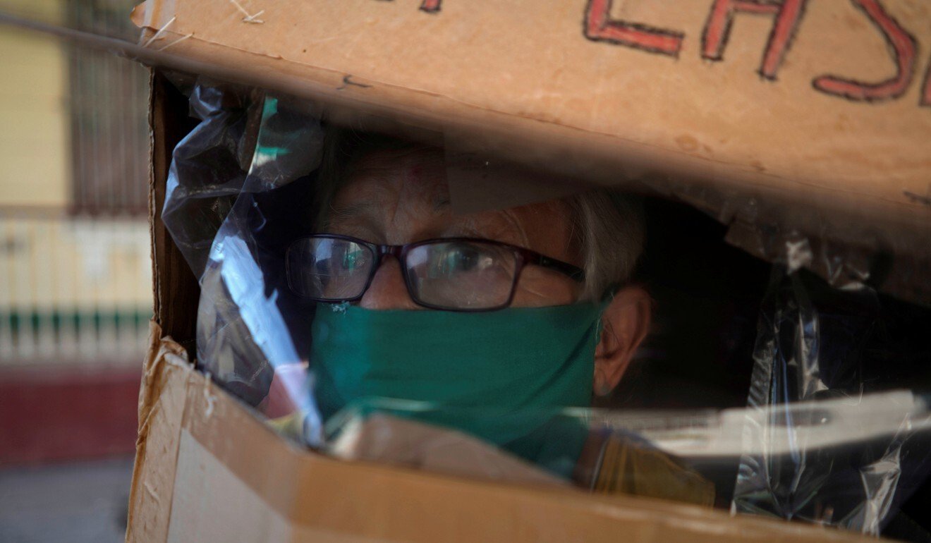 Cuban woman dons full-body cardboard suit against coronavirus | South ...