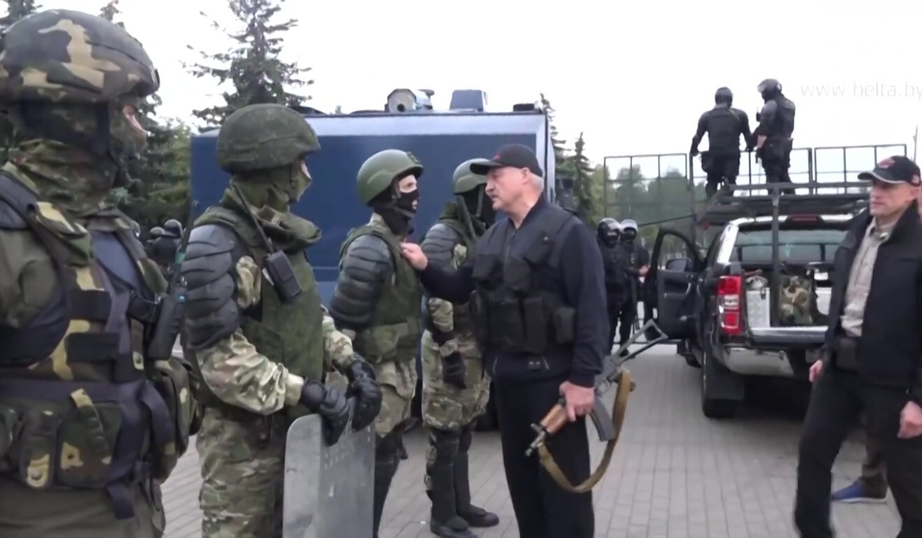 As 100,000 marched in Belarus capital, Lukashenko armed himself with a ...