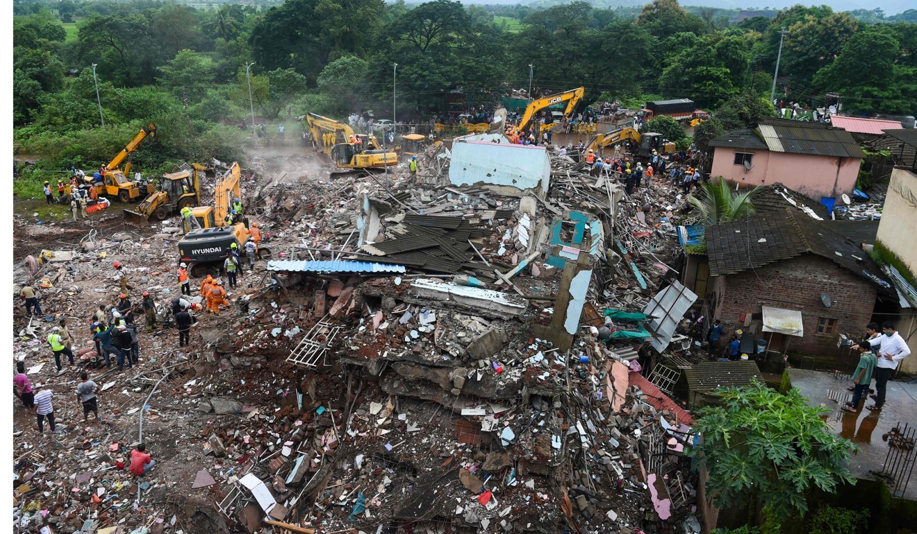 India building collapse: rescuers pull boy, 4, from rubble as search ...