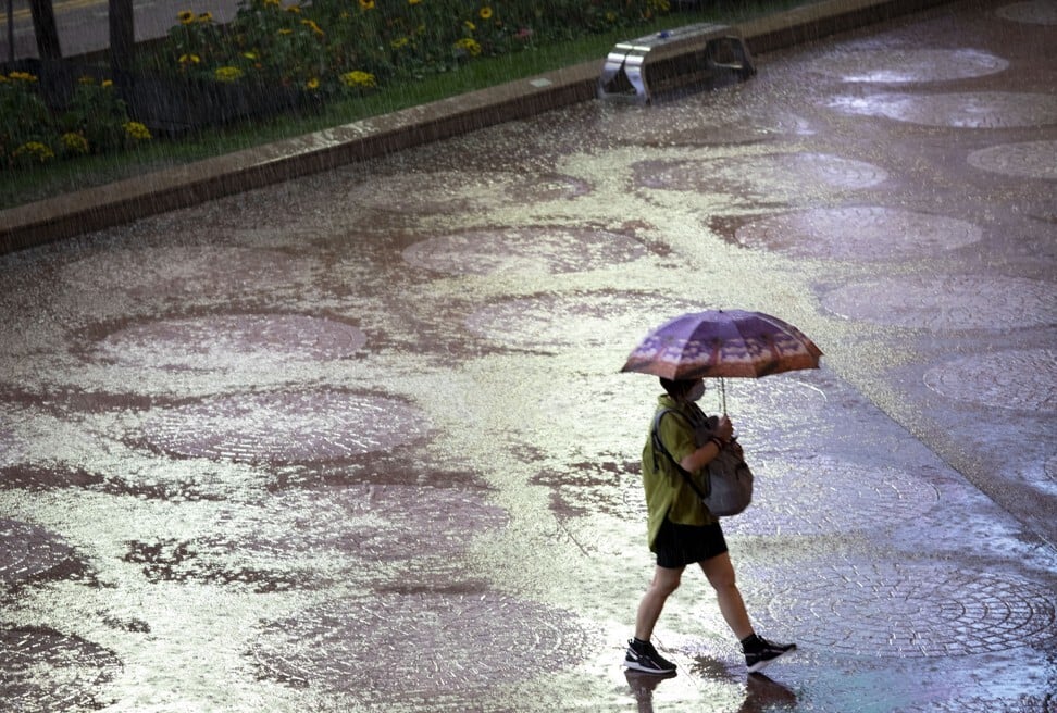 Hong Kong lowers black rainstorm warning, second of the year, to red ...