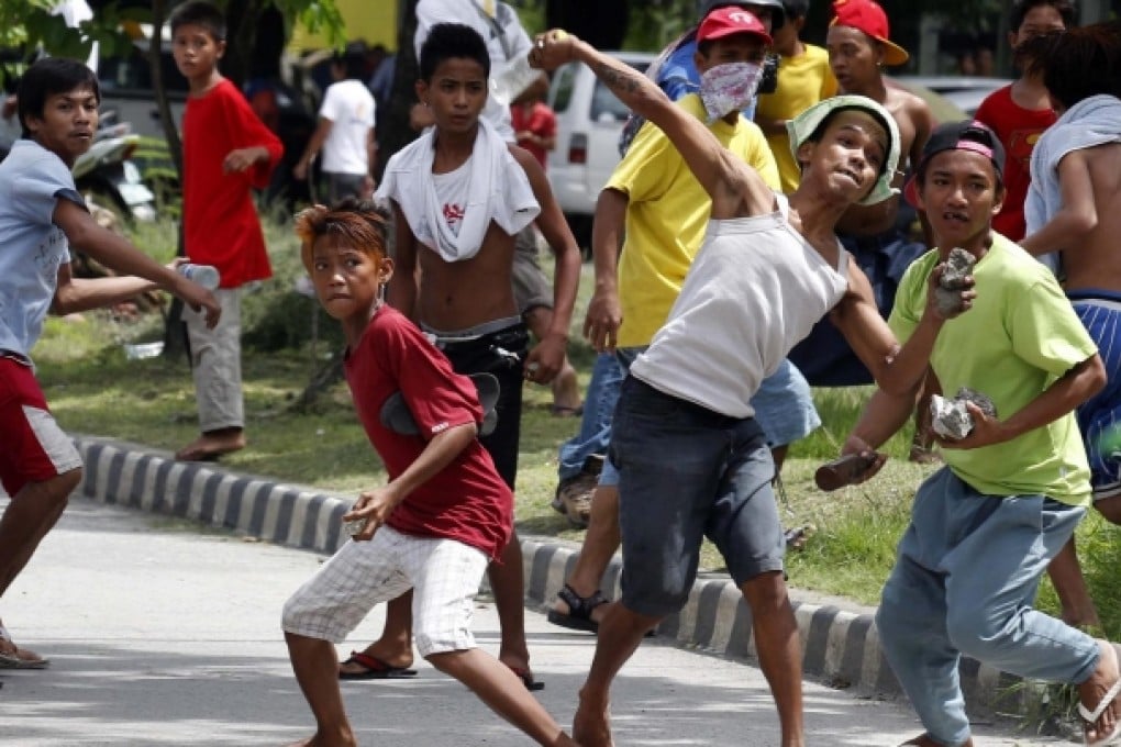 Police battle protesters in Manila slum riot | South China Morning Post