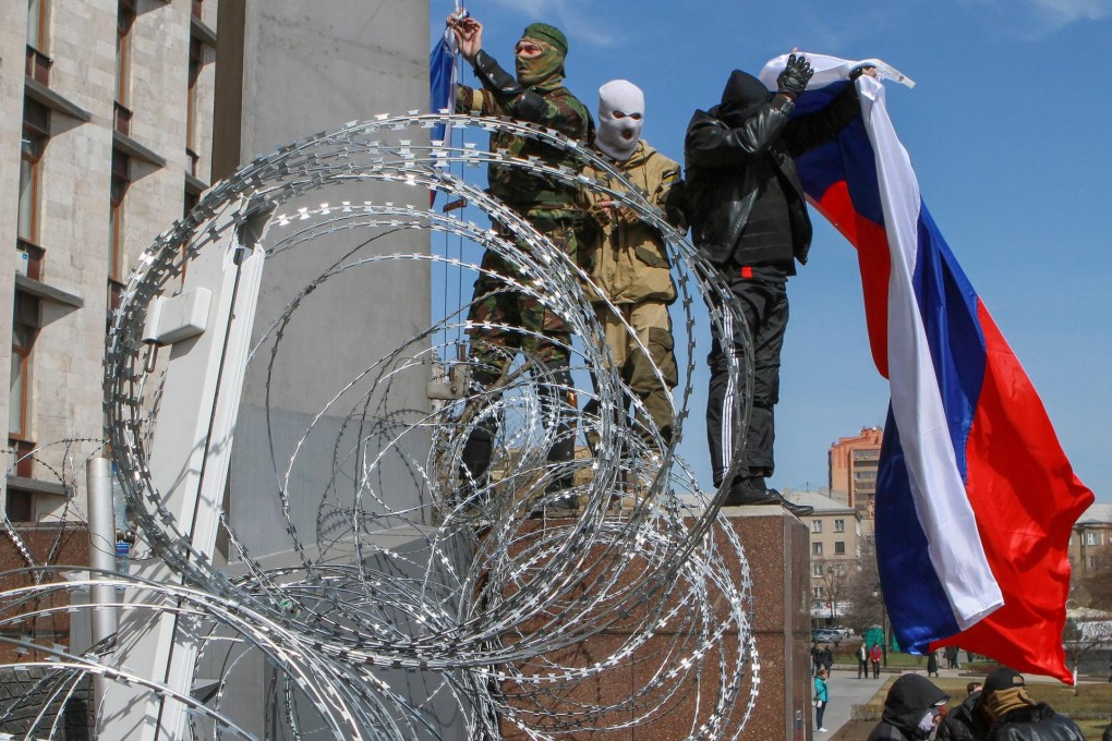 Pro-Russian activists seize arms in Ukraine amid renewed invasion fears ...