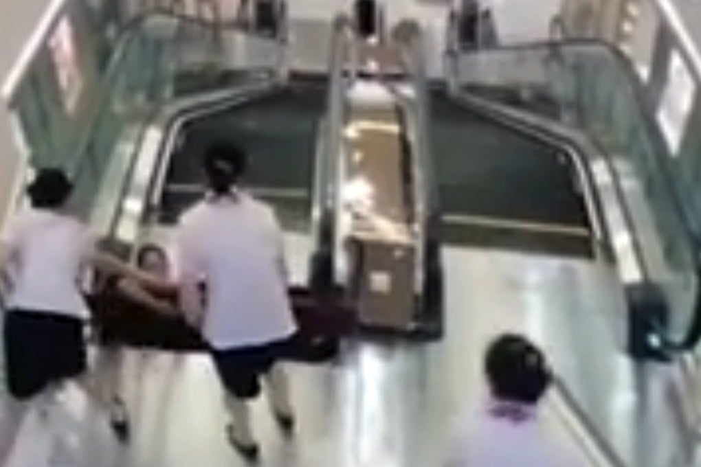 people falling down escalators