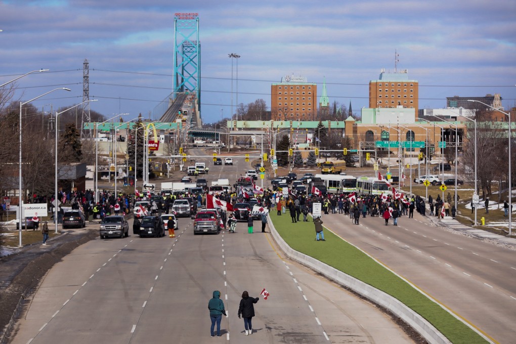 Canada police make first arrest at US border bridge protest as blockade ...