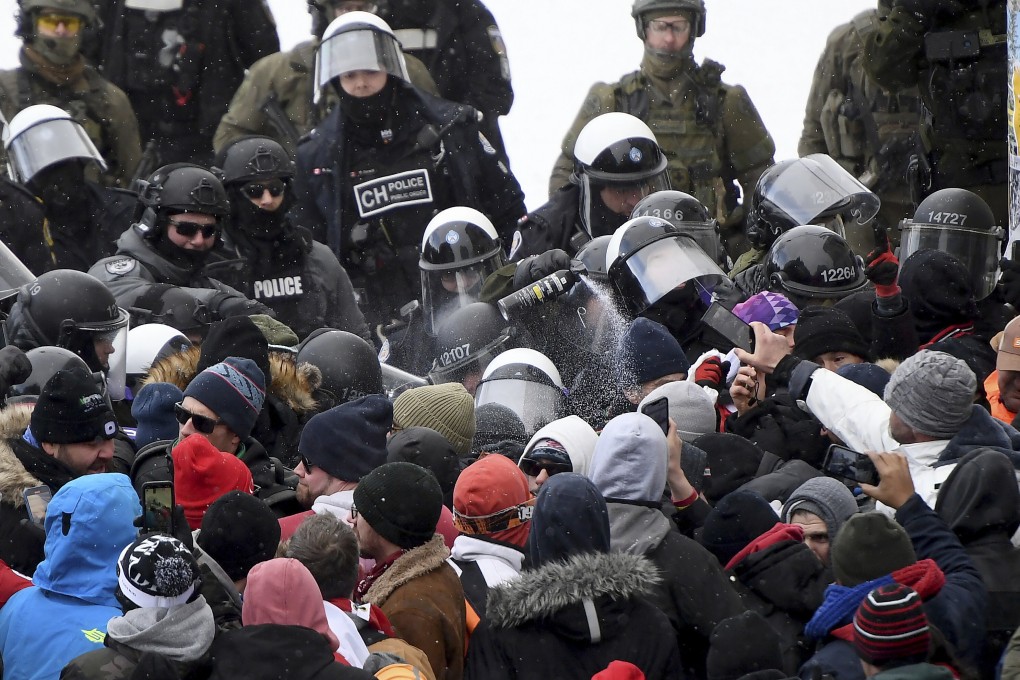 Canadian police in riot gear clear main protest hub in Ottawa as ...
