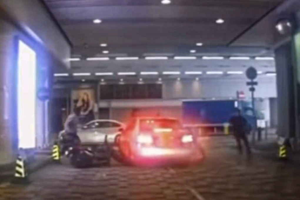 Hong Kong policeman clings to Mercedes-Benz as suspected triad member ...