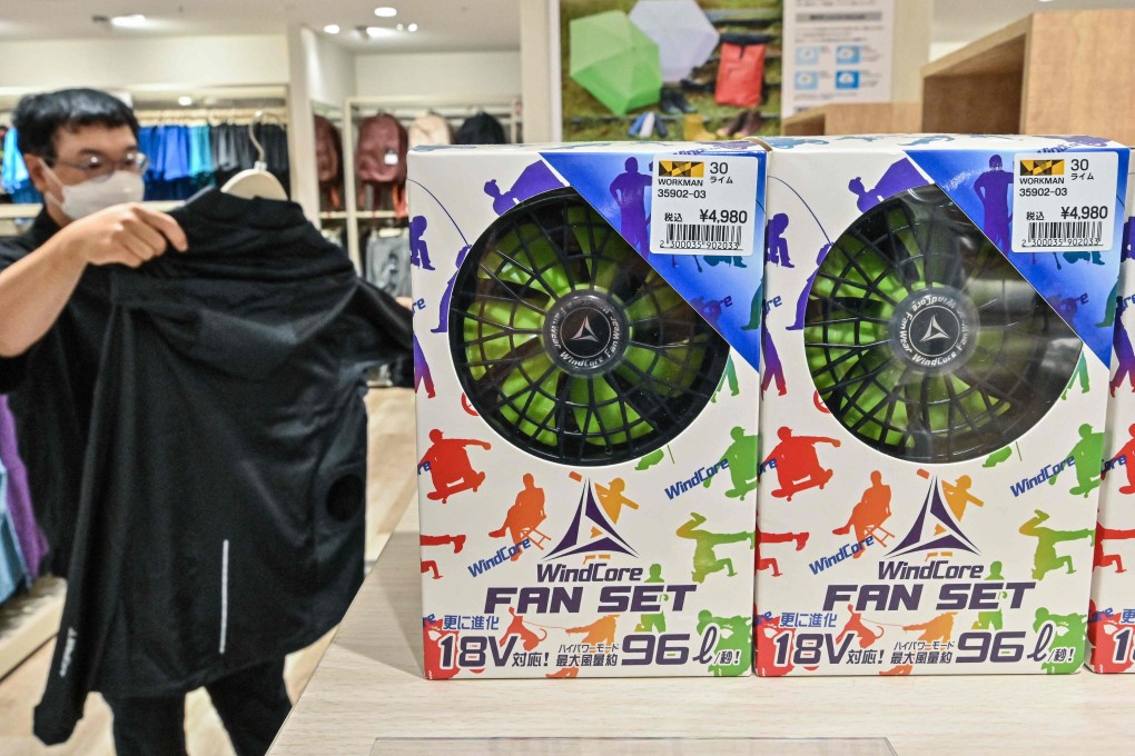 Japanese wear clothes with built-in fans to beat the heat as ...