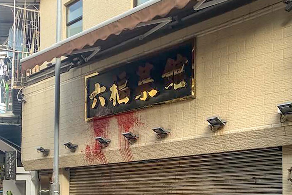 Hong Kong police hunt motorcyclist after red paint splashed on Michelin ...