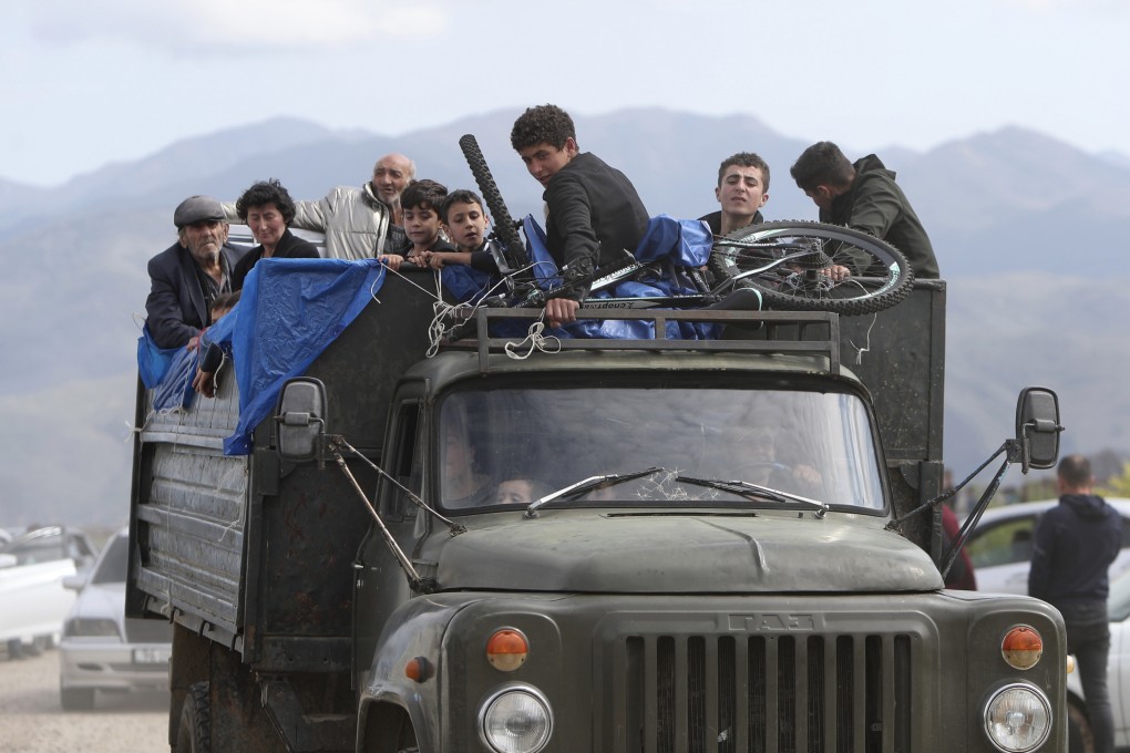 Tens of thousands flee Nagorno-Karabakh to Armenia, death toll rises in ...