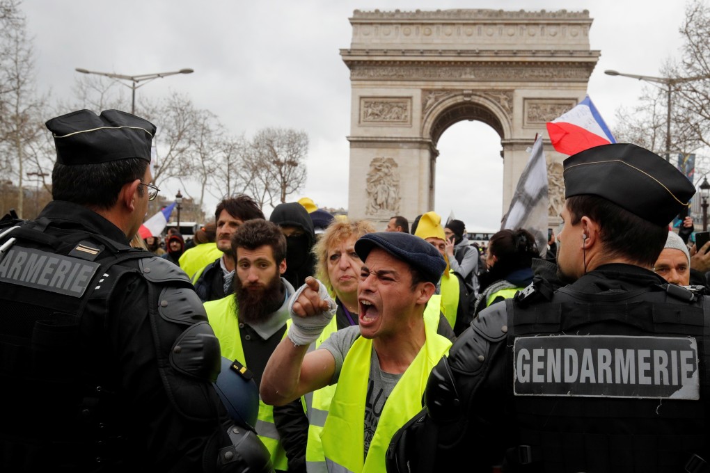 French police fire tear gas as 'yellow vest' protesters loot Paris ...