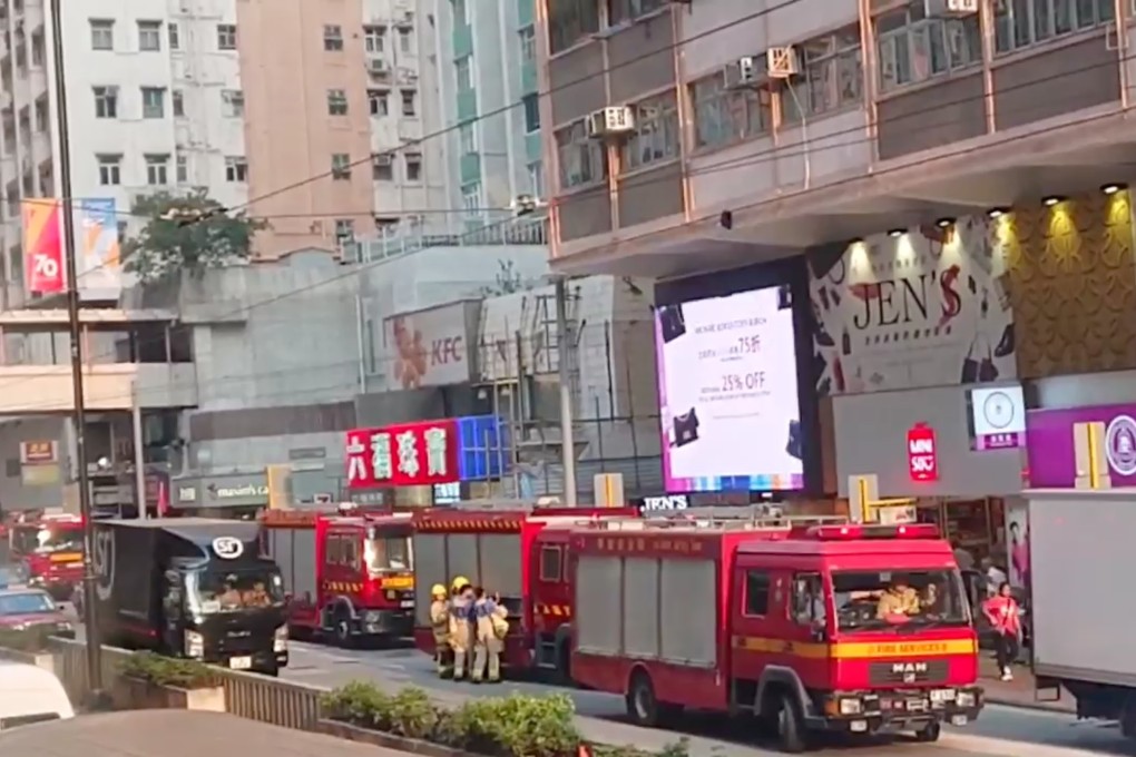 Hong Kong firefighters rescue woman as they battle blaze in North Point ...