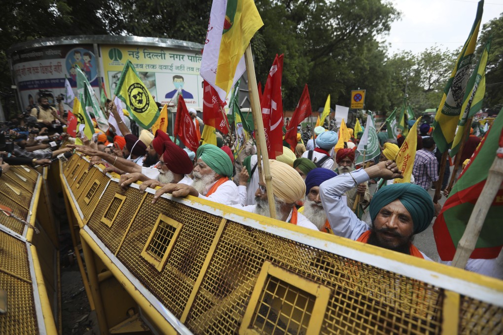 Indian farmers protest against contentious agriculture laws near ...