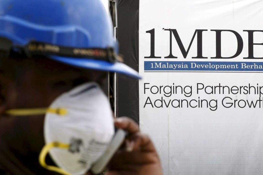 1MDB investigation: Singapore charges former banker with money ...