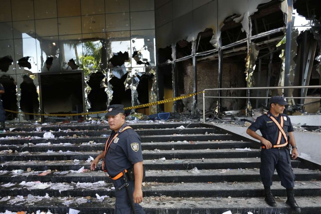 Protester dies, minister sacked after Paraguay riots | South China ...