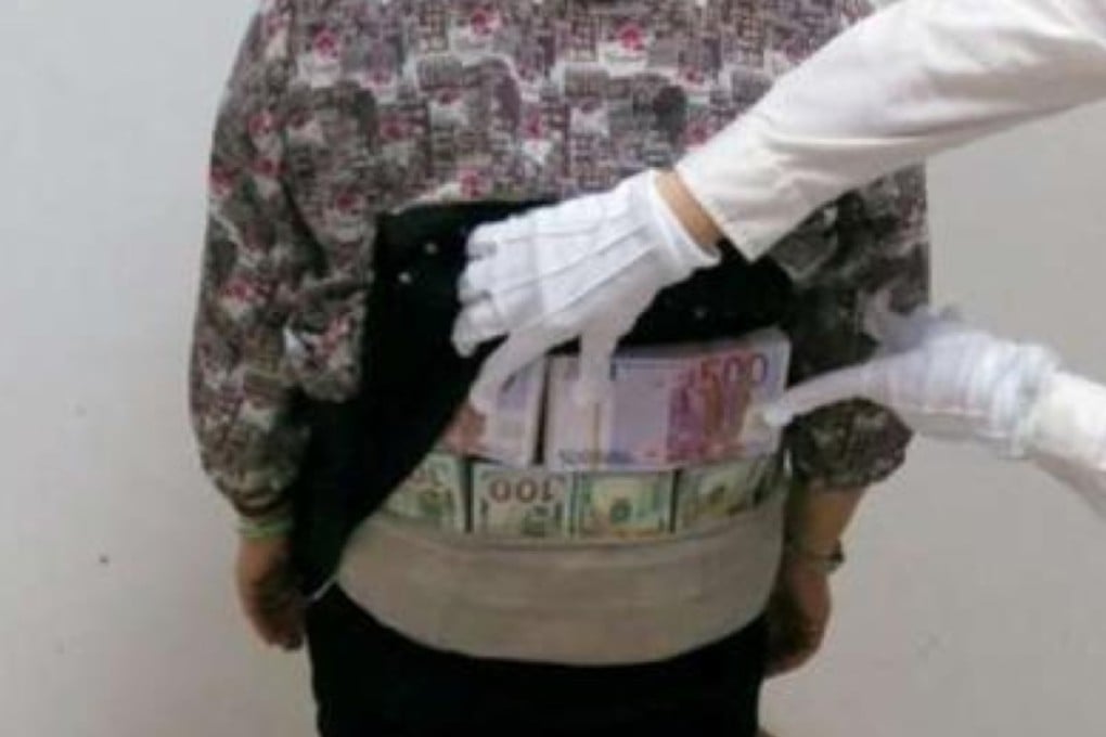Women with banknotes taped to their bodies tried to carry more than HK ...